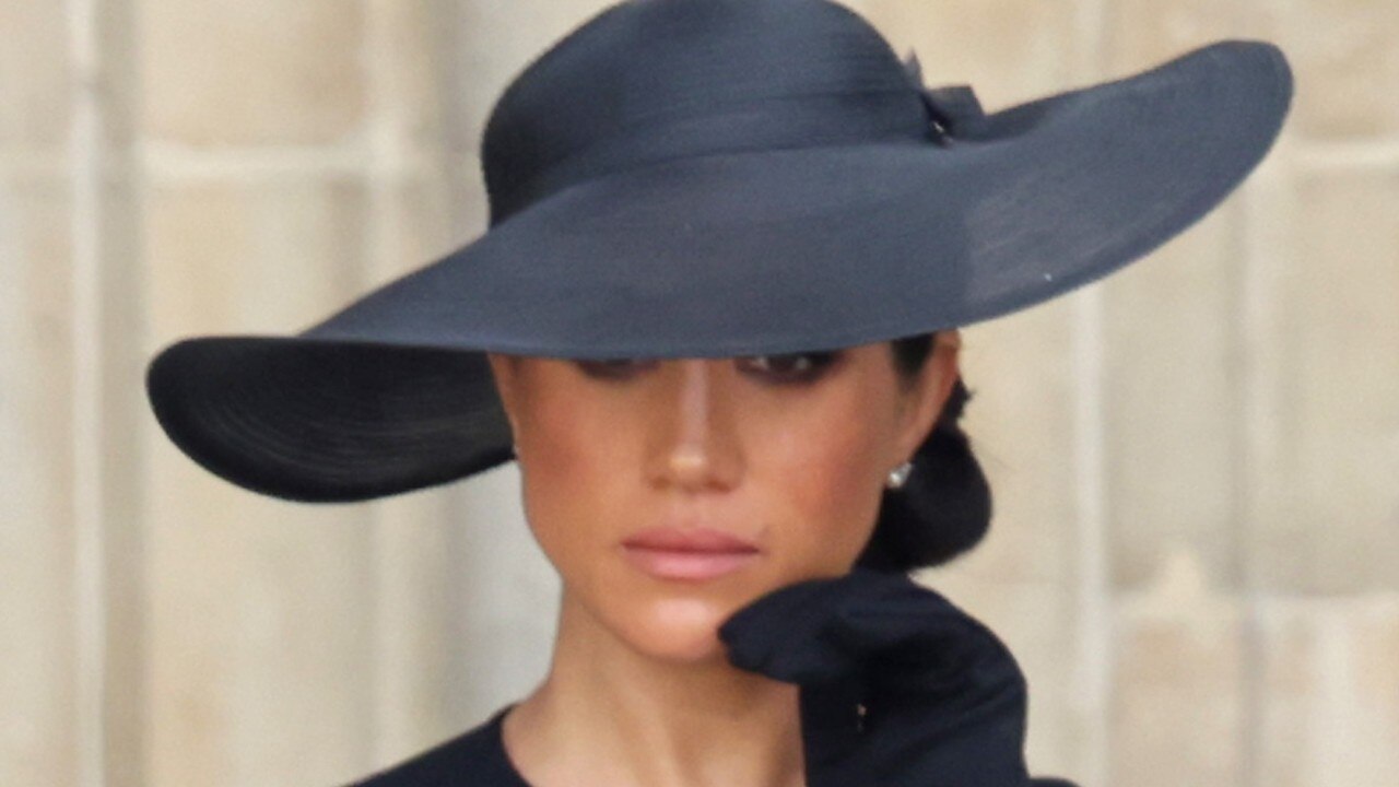 Meghan Markle seen wiping away tears with a gloved hand as Queen ... Meghan Markle seen wiping away tears with a gloved hand as Queen ...