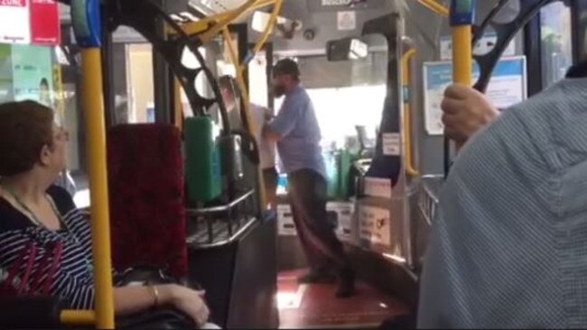 Driver And Passenger Fight On Bus And Spill Onto The Street In Morning