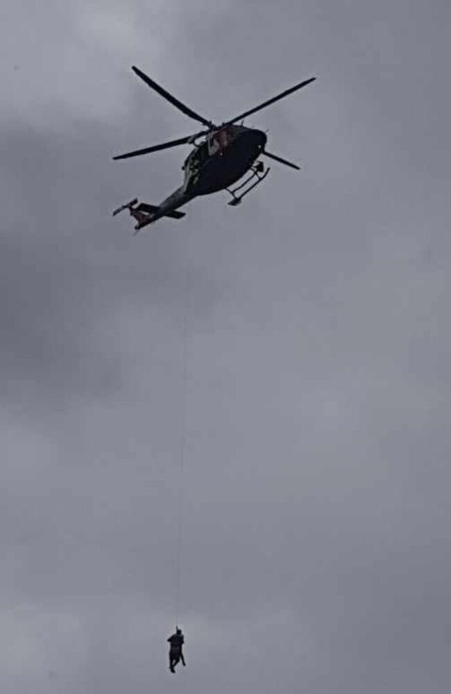 Photo Dramatic Helicopter Rescue Of Man Trapped In Flood Waters